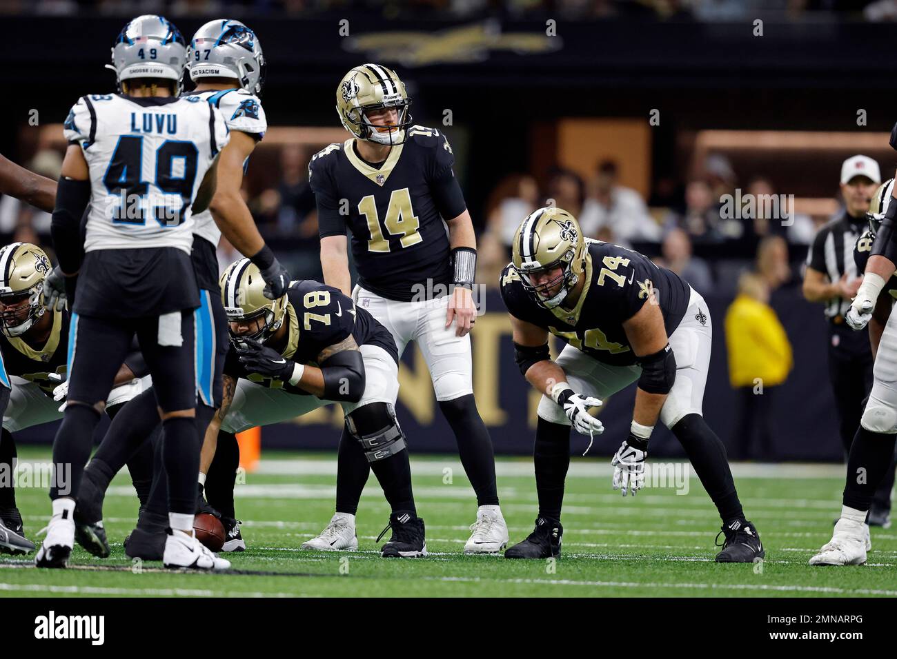 New Orleans Saints quarterback Andy Dalton (14) and offensive tackle ...