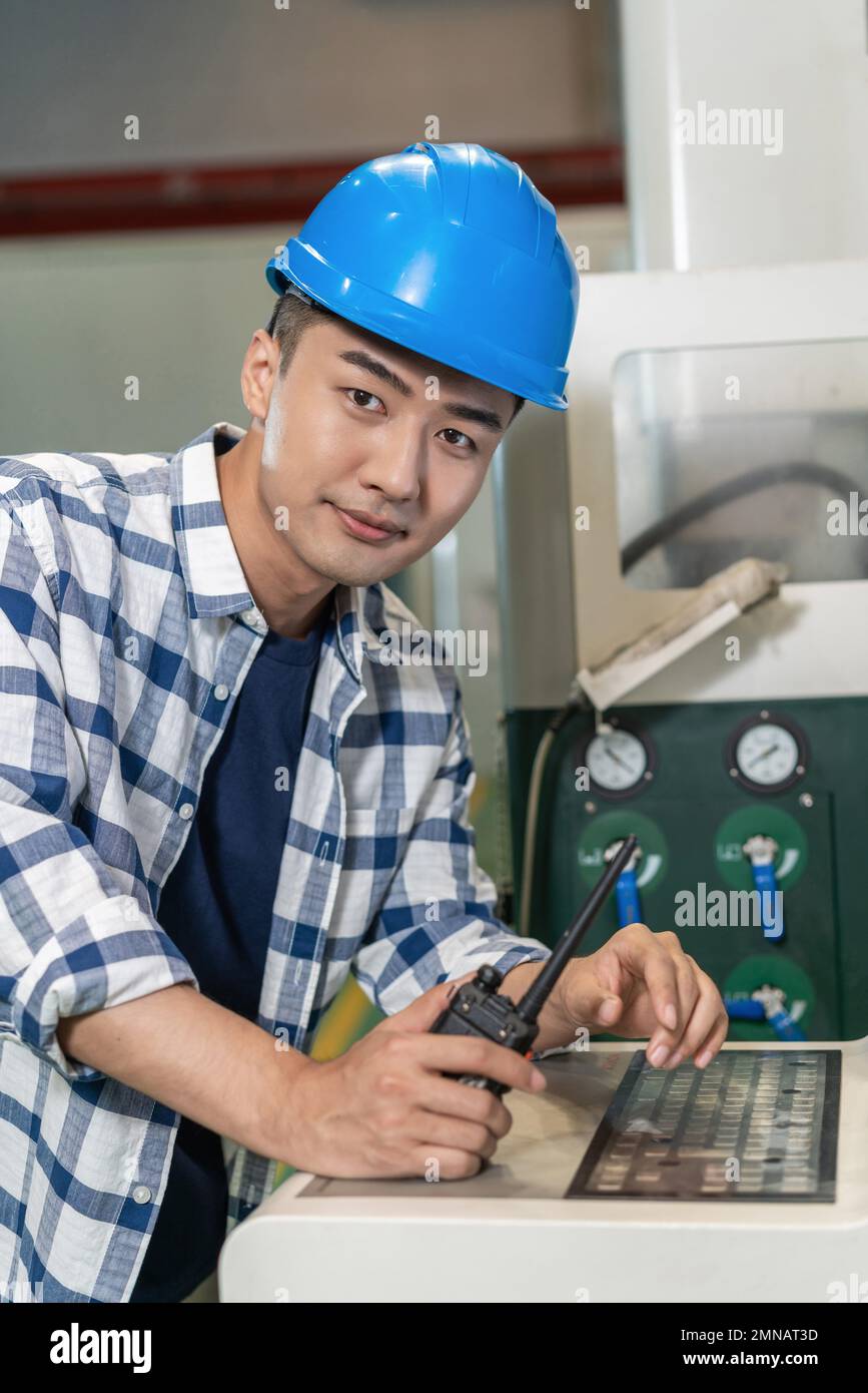 Engineers working in the factory Stock Photo - Alamy
