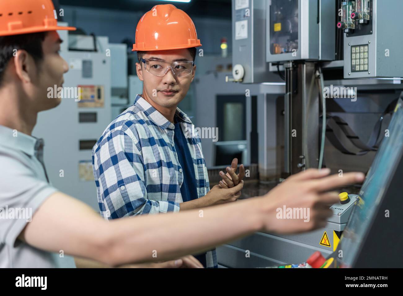 Two engineers working in the factory Stock Photo - Alamy