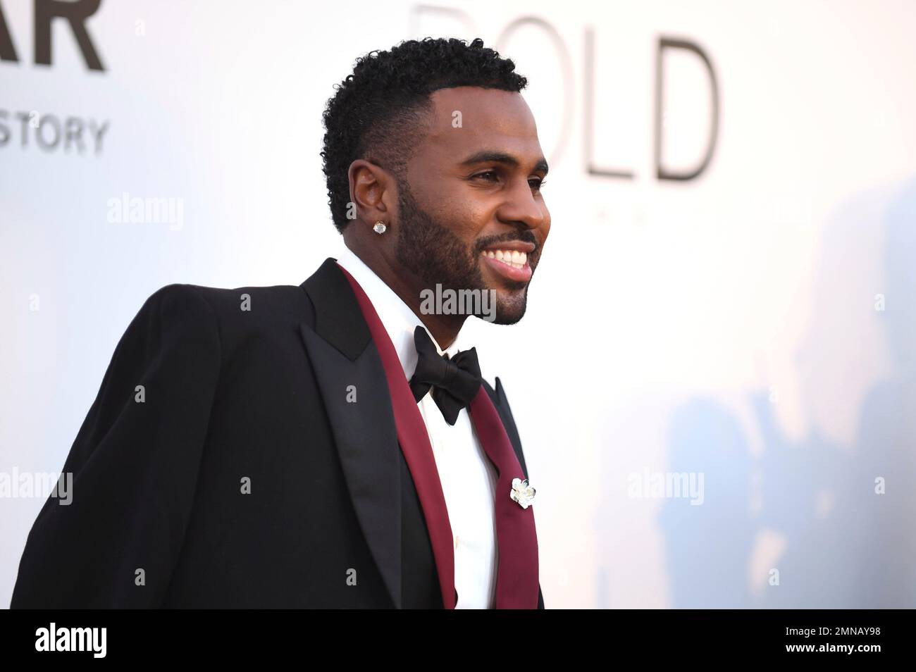 Singer Jason Derulo poses for photographers upon arrival at the amfAR ...