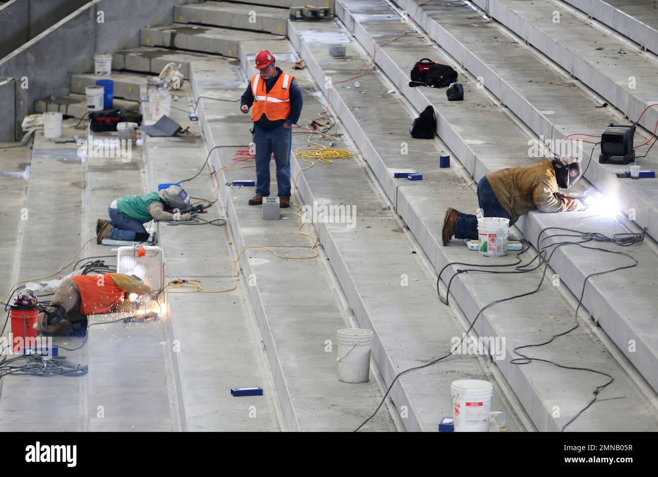 Construction crews work on the Louis Armstrong Stadium at the Billie ...