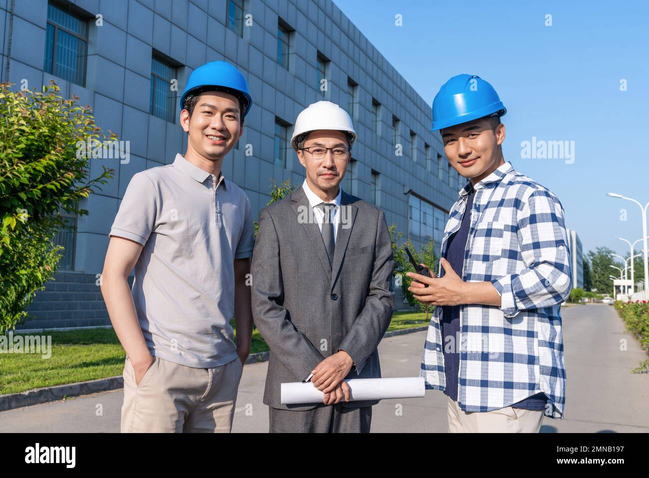 Three engineers working in the outdoor Stock Photo - Alamy