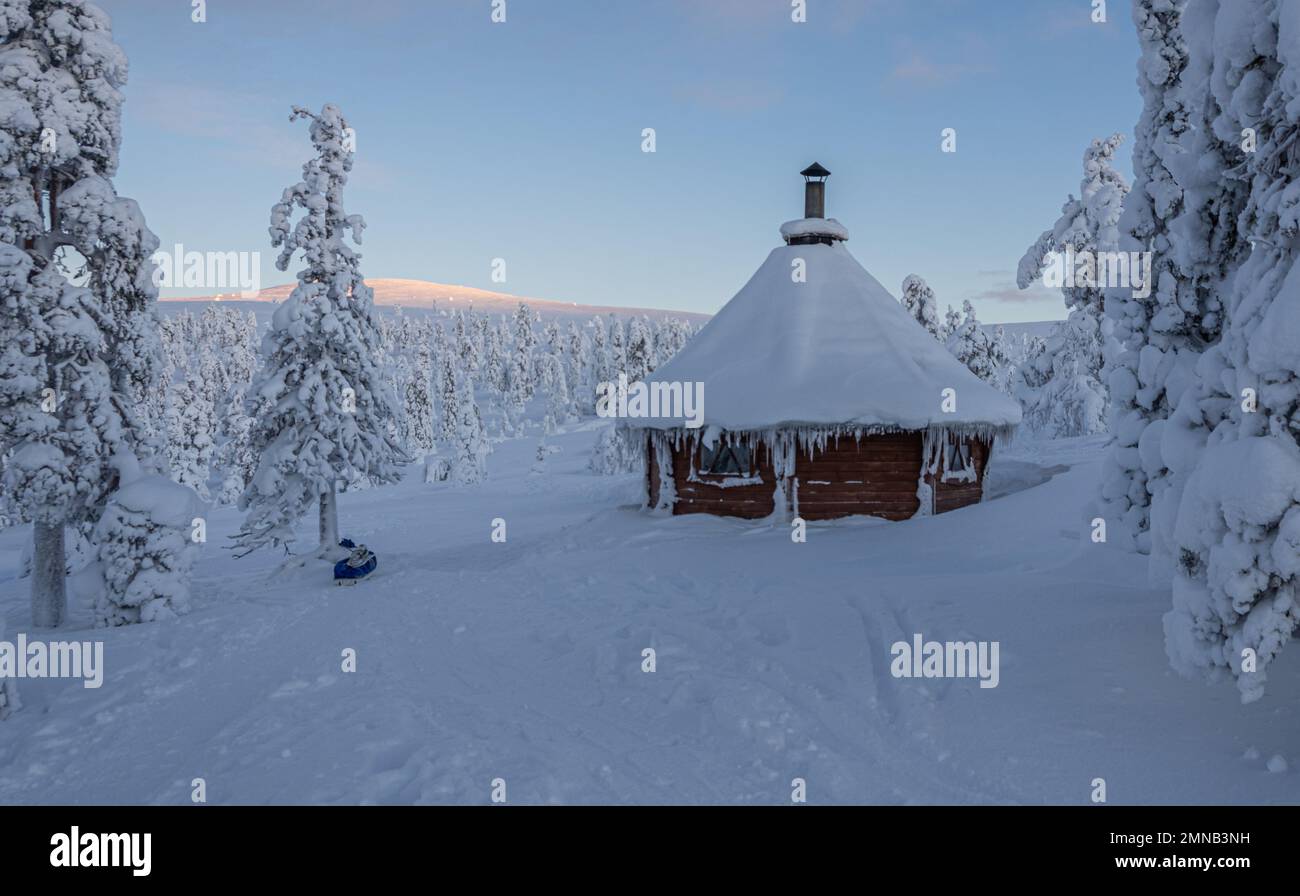 Wilderness hut in snowy fell landscape in Finland's Lapland. There are ...