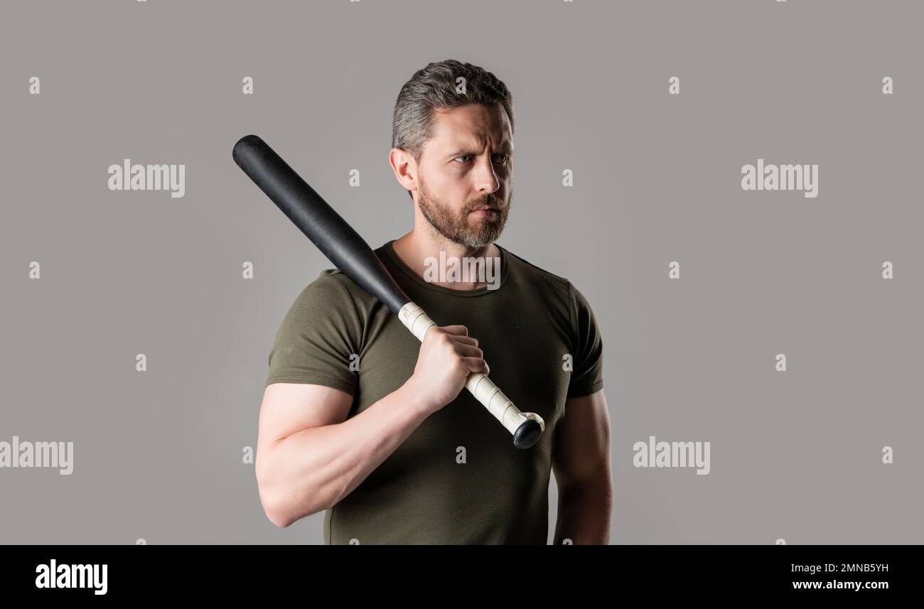 hooligan man with bat isolated on grey studio background. hooligan man ...