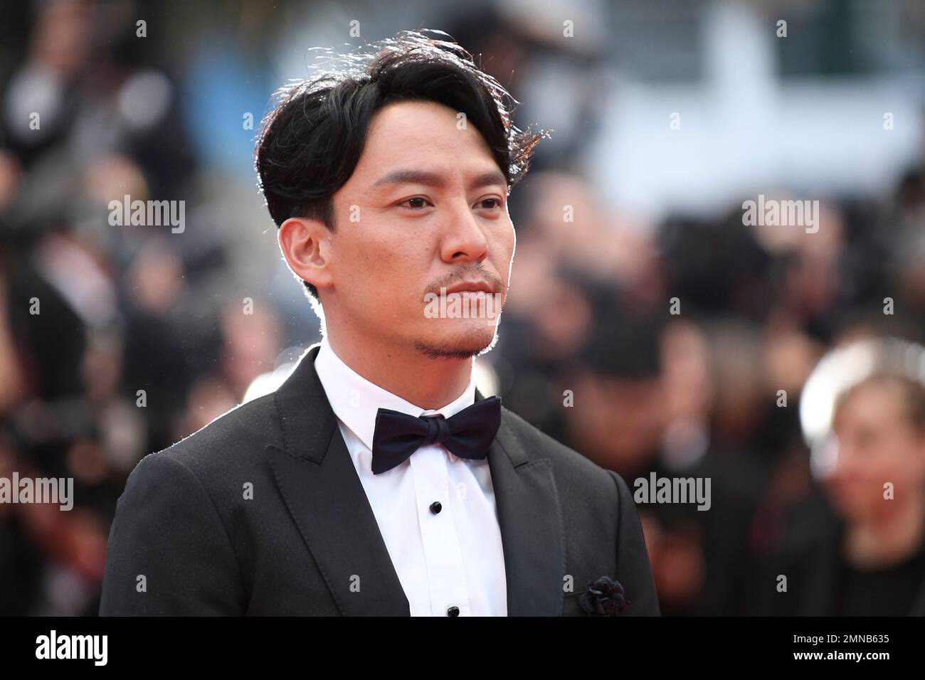 Jury member Chang Chen poses for photographers upon arrival at the ...