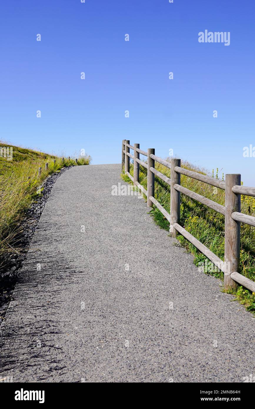 pedestrian path go up in the mountains horizon Stock Photo - Alamy
