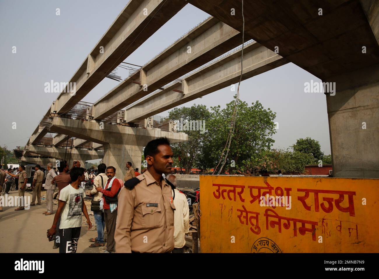 Indians look at the spot after a highway overpass being built collapsed ...