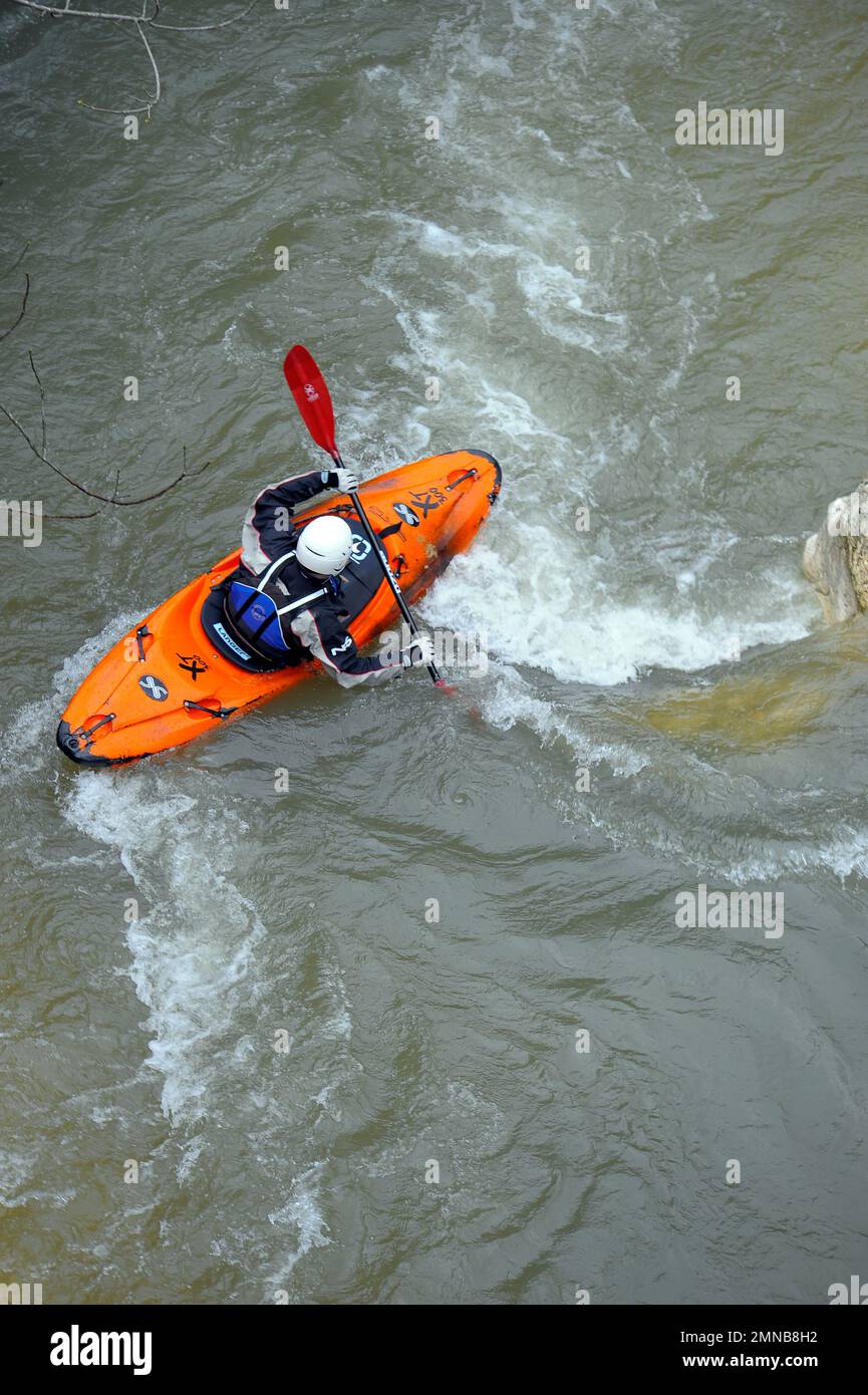 A whitewater kayaker running a rapid on the river Stock Photo - Alamy