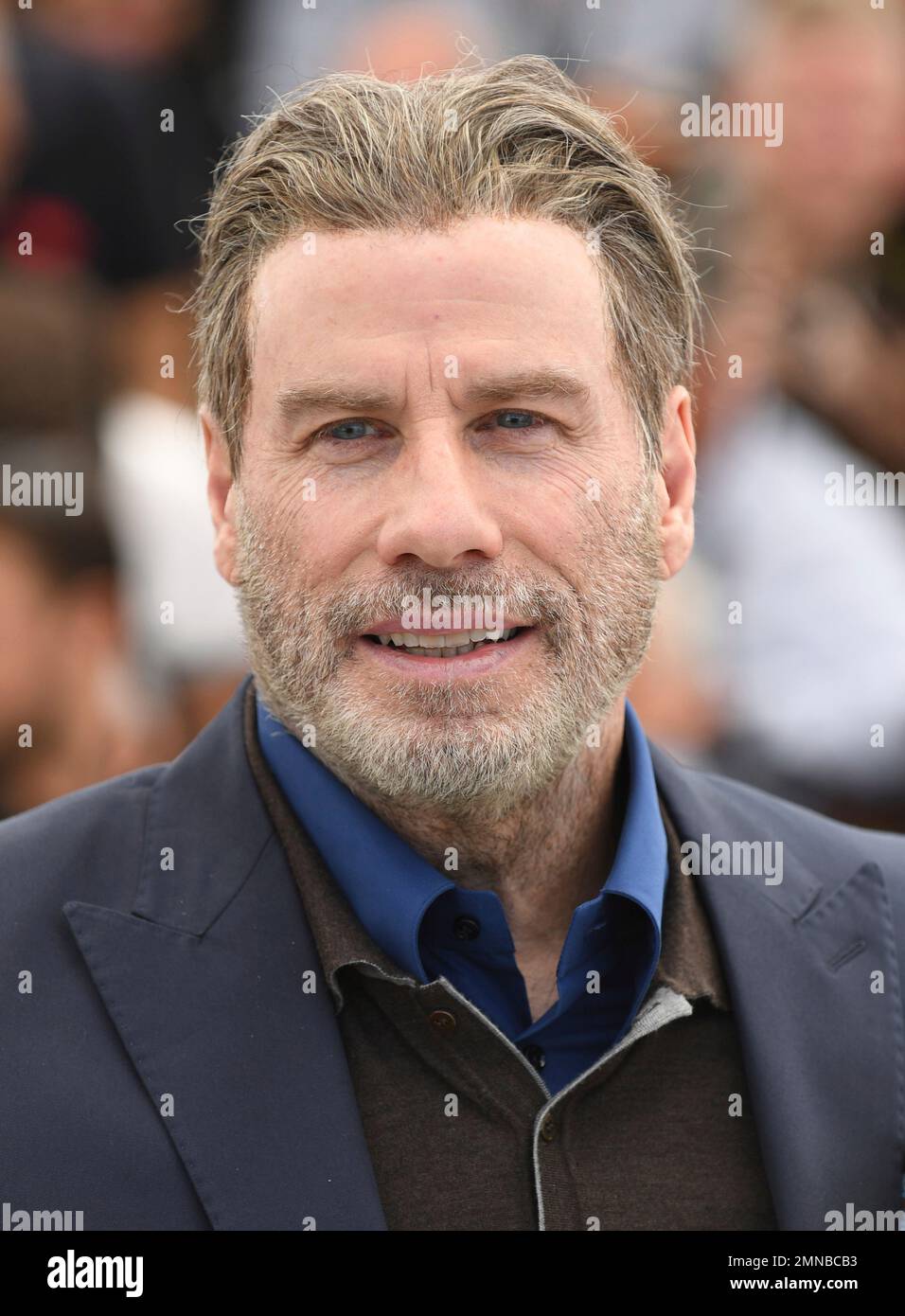 Actor John Travolta poses for photographers during a photo call for the ...