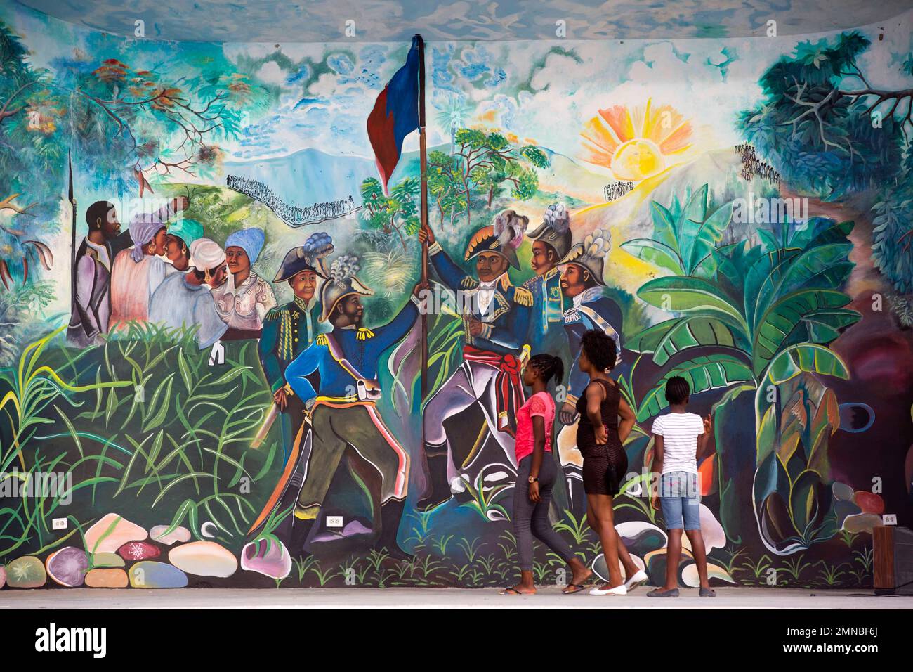 Residents look at a mural depicting the independence heroes ahead of ...
