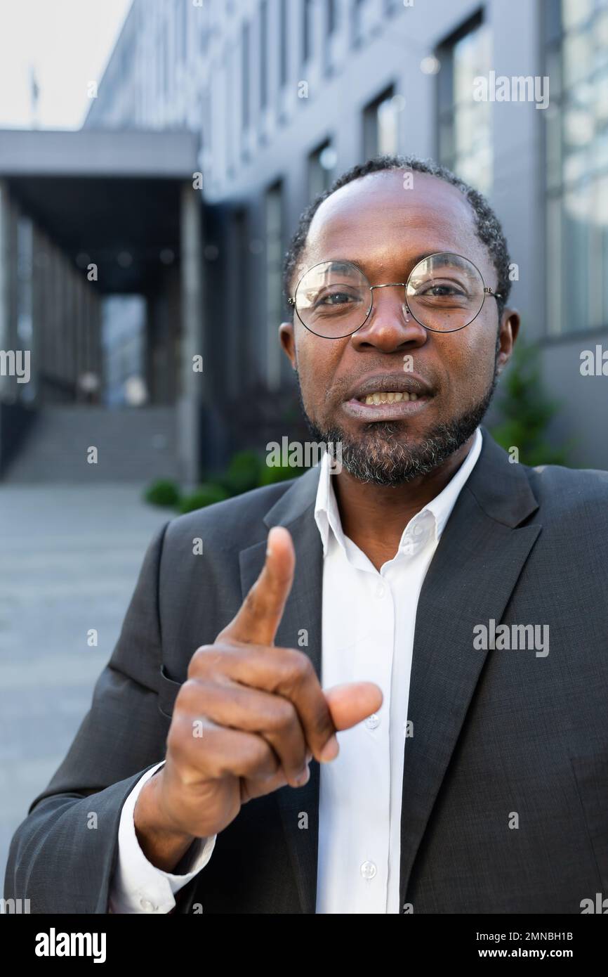 Young african american businessman, broker, real estate agent standing ...