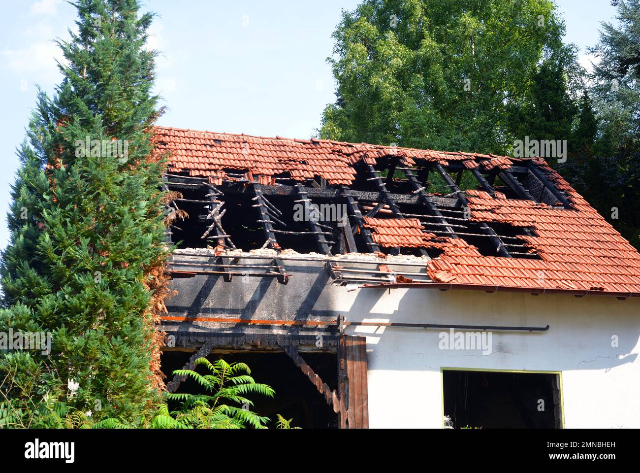 Fire ruin of a small house Stock Photo - Alamy