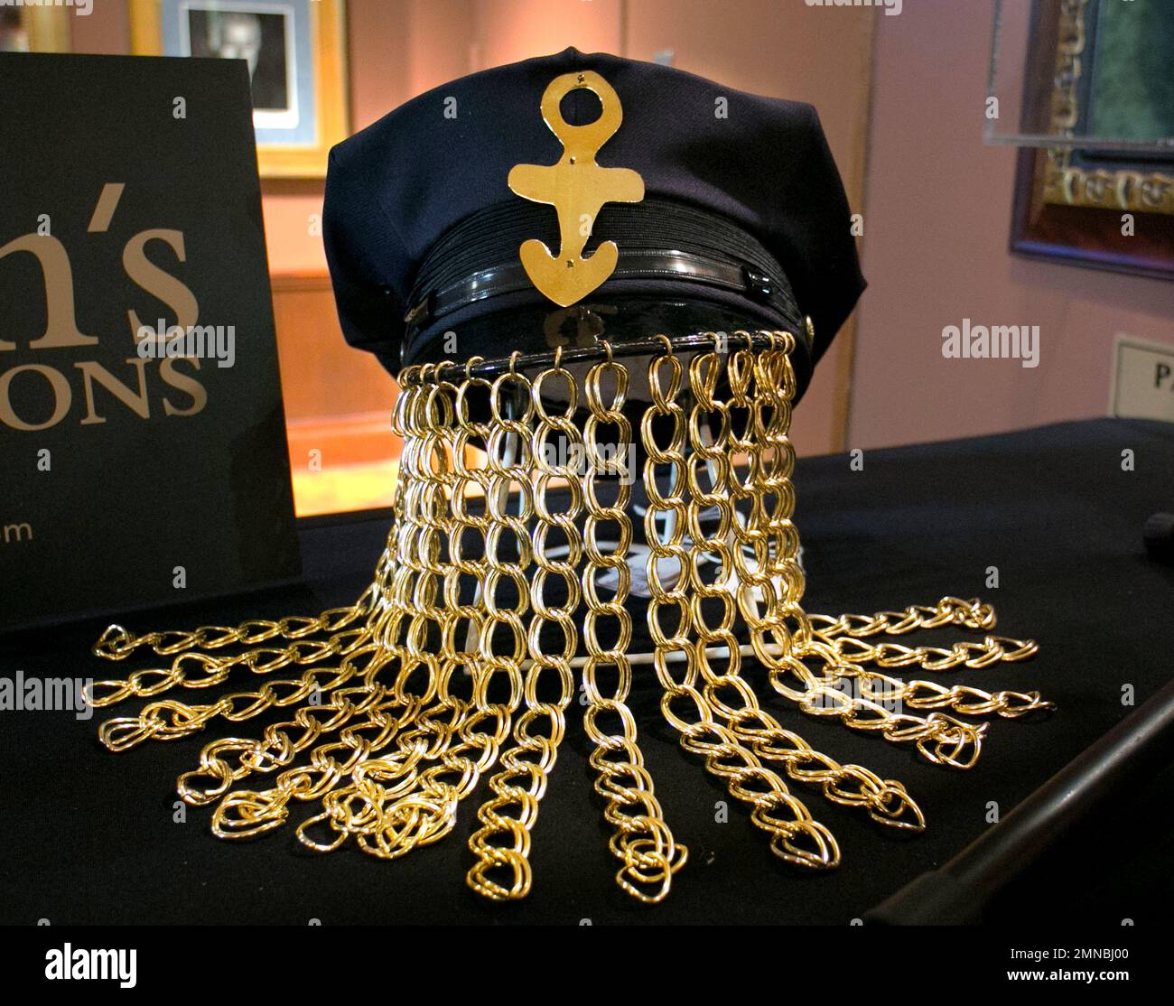 A blue uniform hat with gold chains, worn by the late pop singer Prince ...