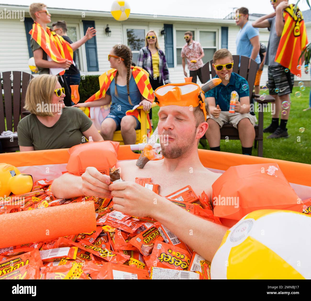 IMAGE DISTRIBUTED FOR REESE'S - Reese’s super fan, Jon Ernst (center ...