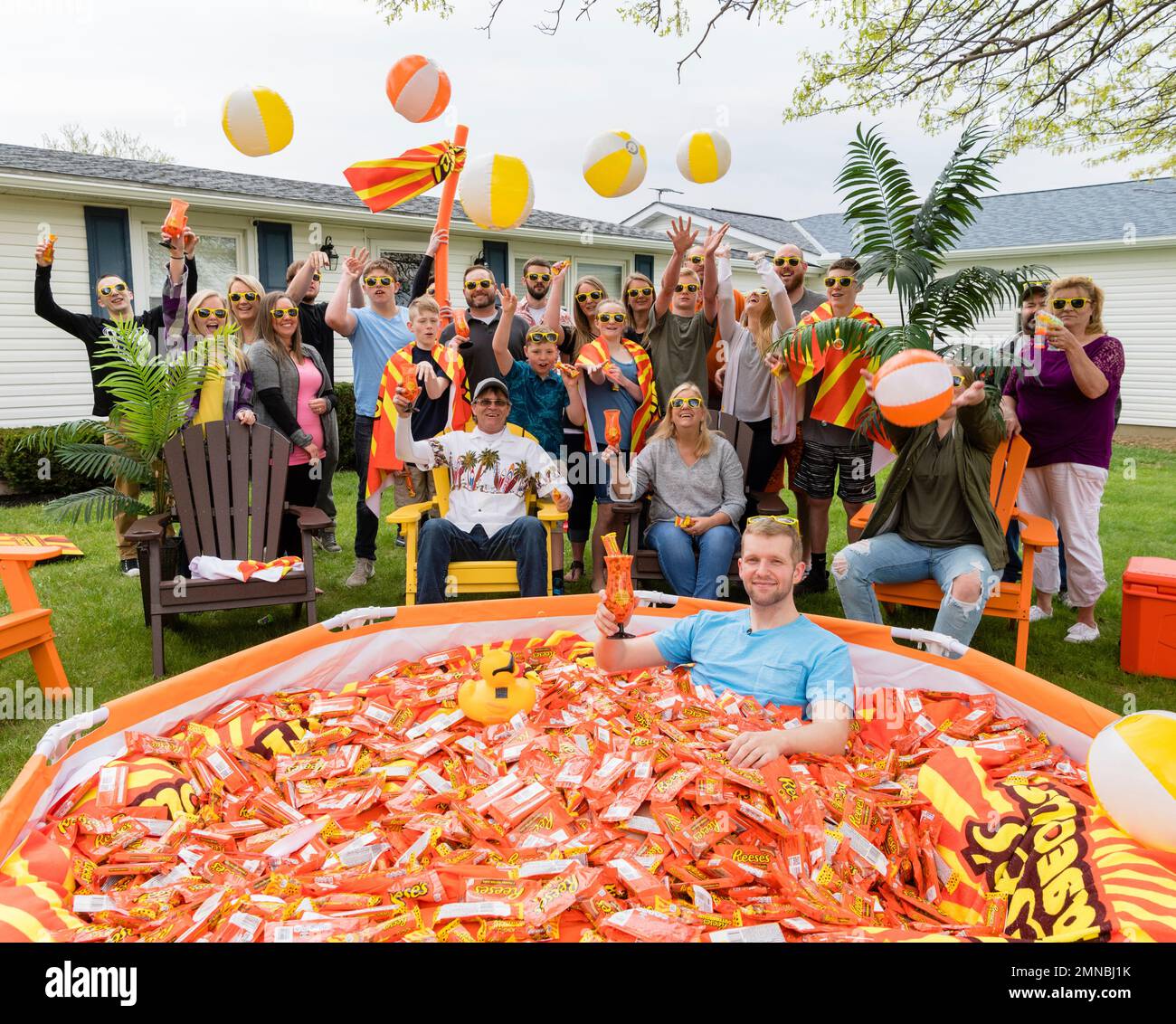 IMAGE DISTRIBUTED FOR REESE'S - Reese’s super fan, Jon Ernst (center ...