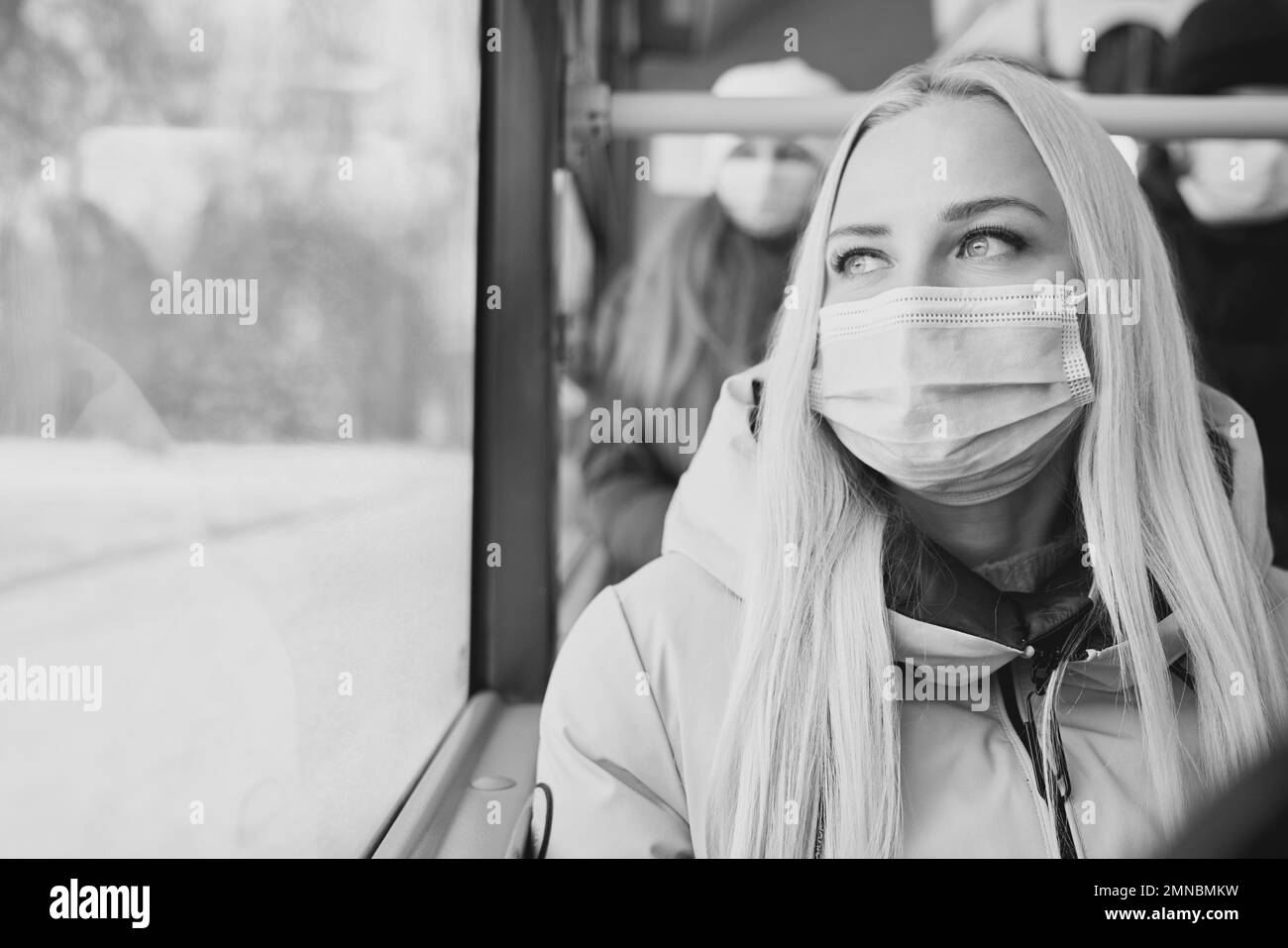 Front view of passengers sitting on bus, protecting from global ...