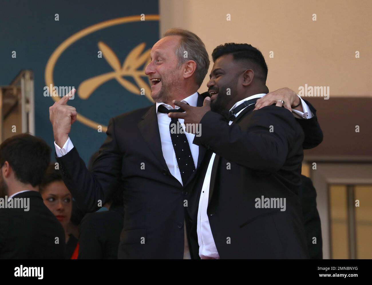 Actors Benoit Poelvoorde, left, and Balasingham Thamilchelvan pose for photographers upon ...