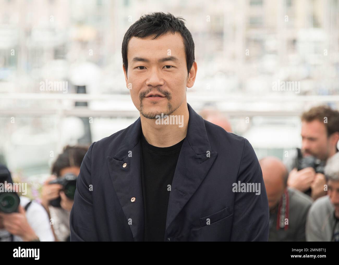 Actor Liao Fan poses for photographers during a photo call for the film ...