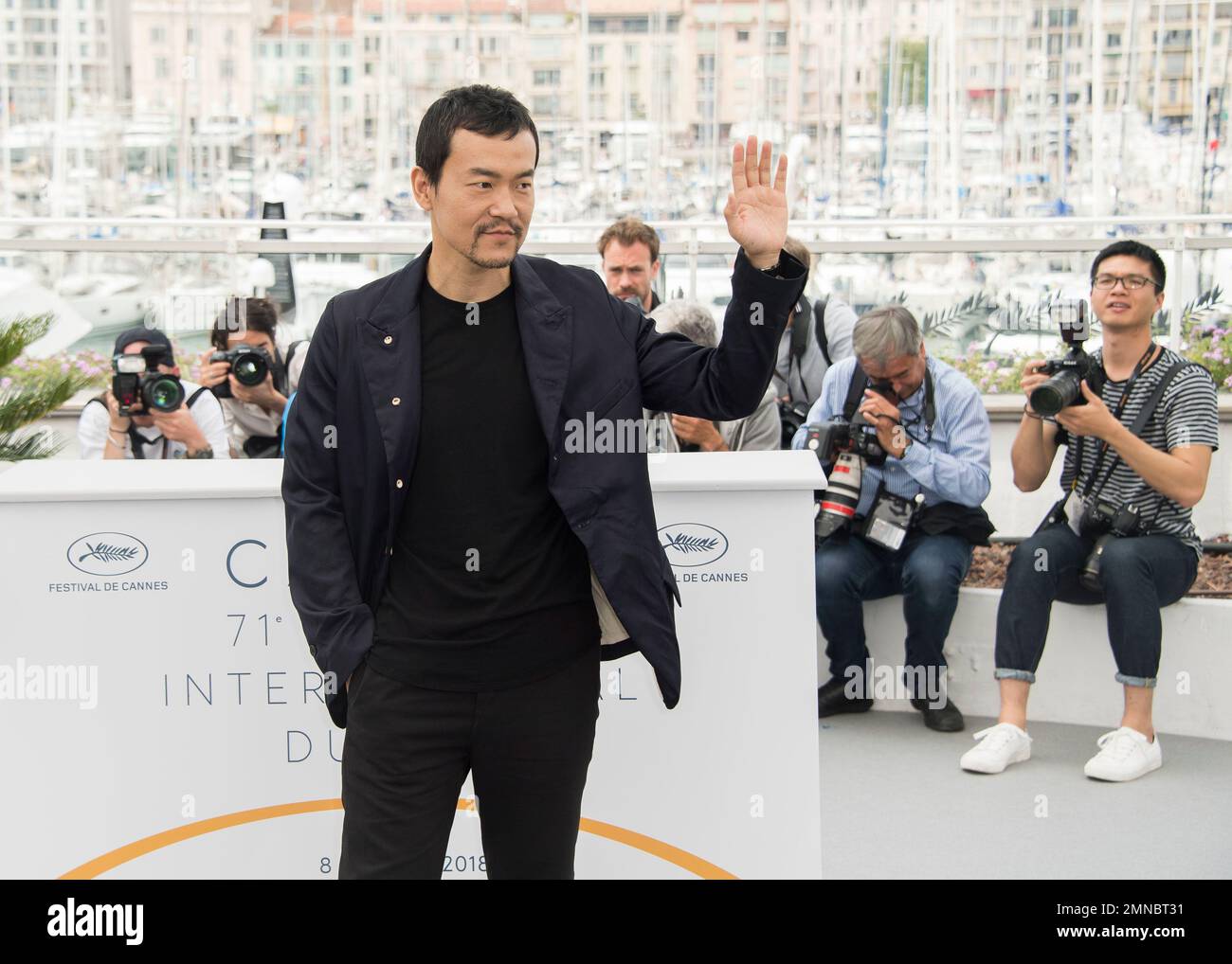 Actor Liao Fan poses for photographers during a photo call for the film ...