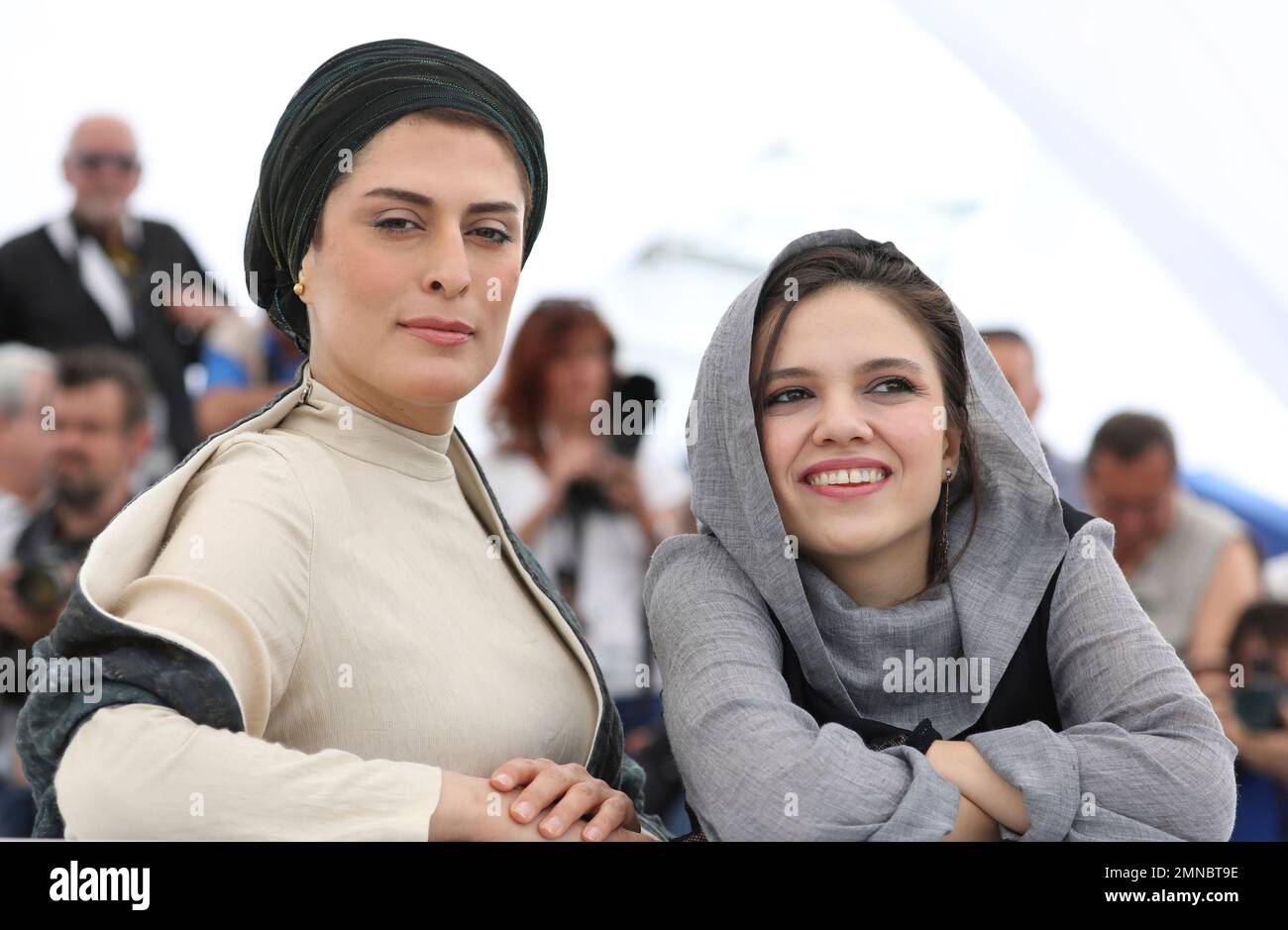 Actresses Behnaz Jafari, left, and Marziyeh Rezaei pose for photographers during a photo call ...