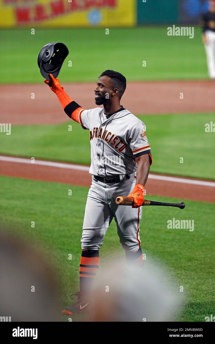 San Francisco Giants' Andrew McCutchen acknowledges fans as he walks to ...