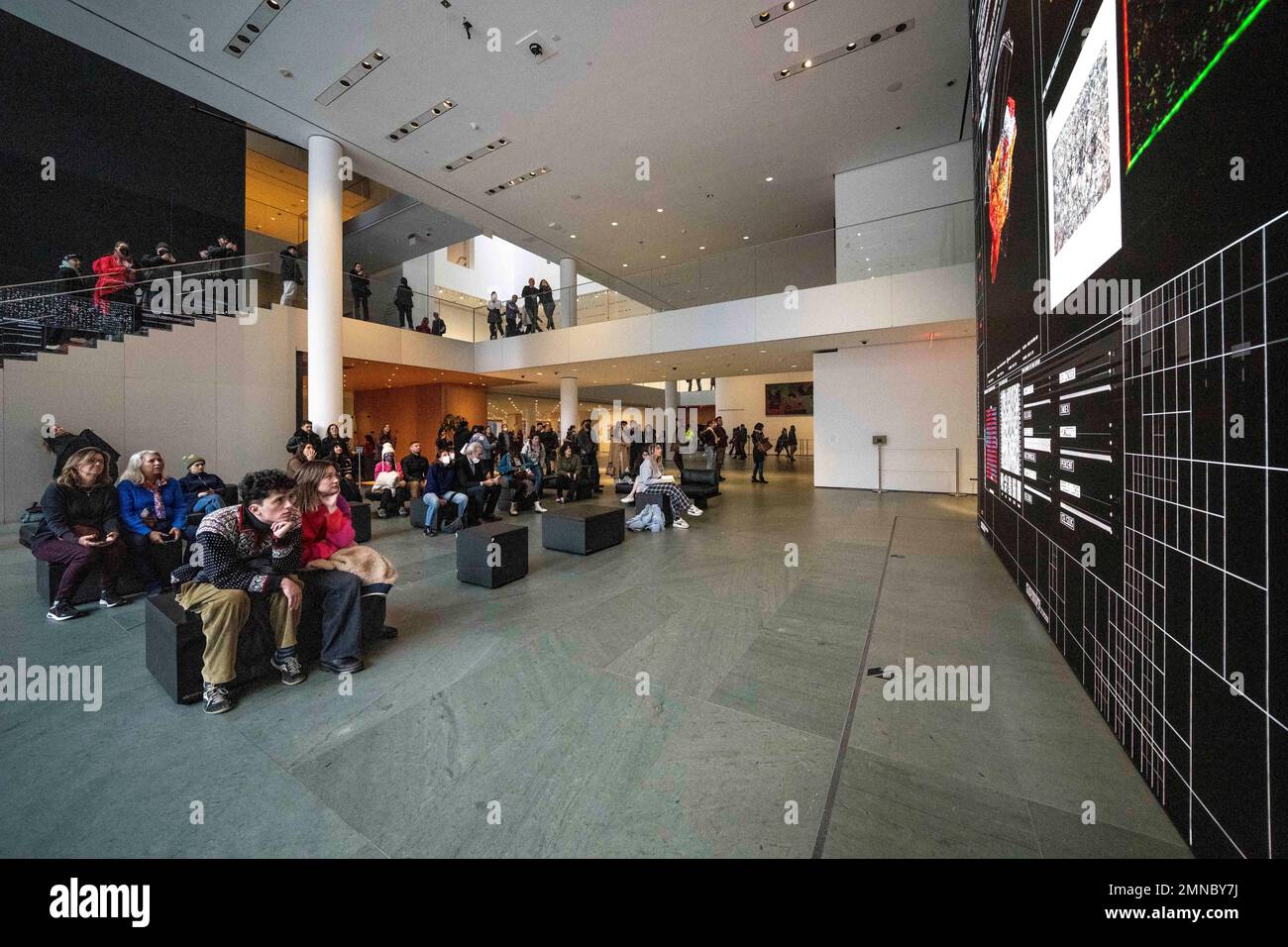 Visitors browse Refik Anadol's "Unsupervised" exhibit at the Museum of ...
