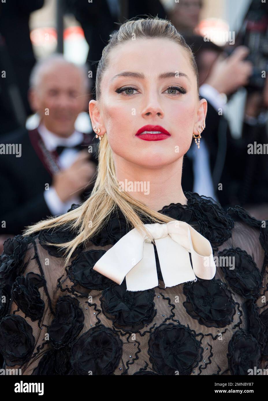 Actress Amber Heard poses for photographers upon arrival at the ...