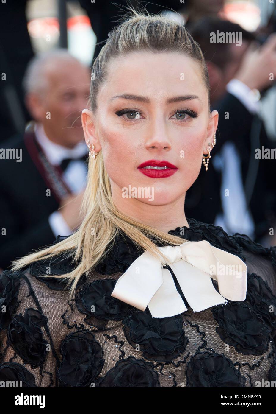 Actress Amber Heard poses for photographers upon arrival at the ...