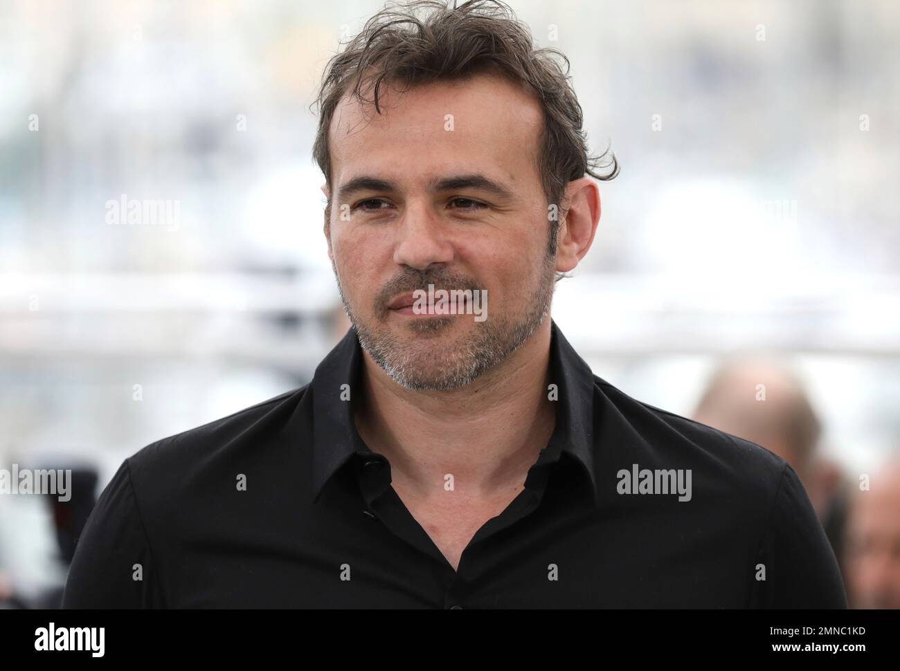 Actor Stephane Rideau poses for photographers during a photo call for ...