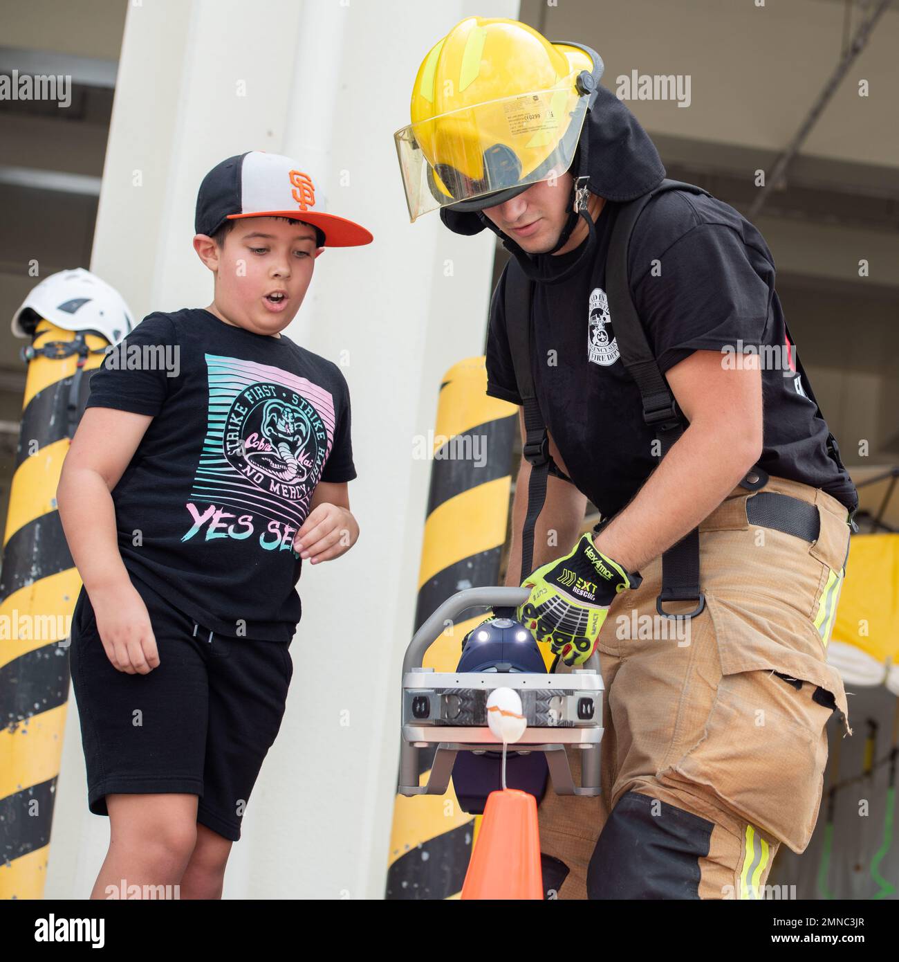 An 18th Civil Engineer Squadron firefighter operates safety equipment ...
