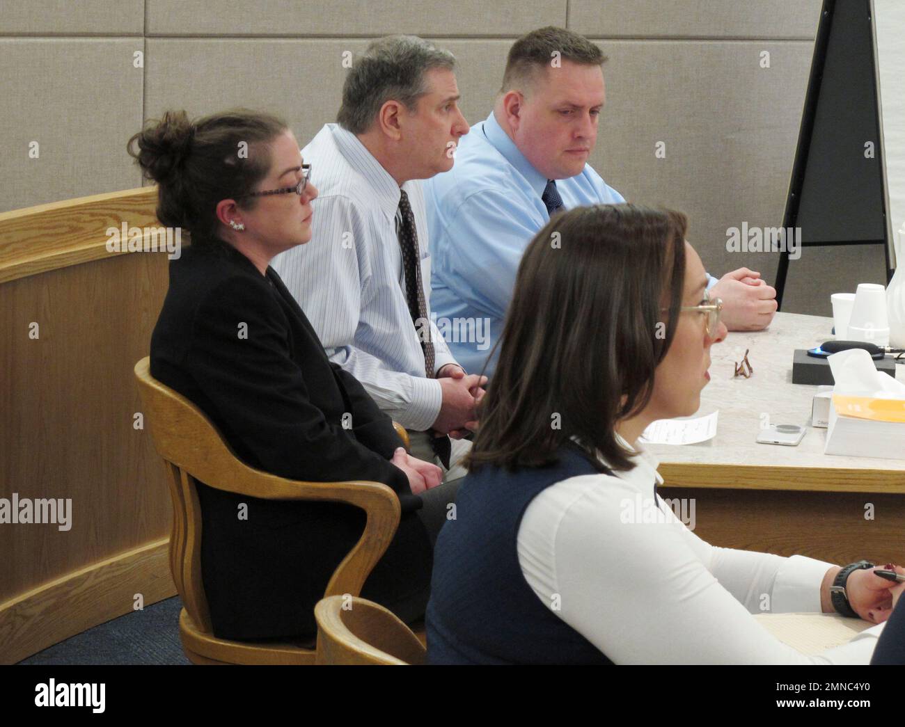 Mark Desimone, second from right, is shown following the jury verdict ...