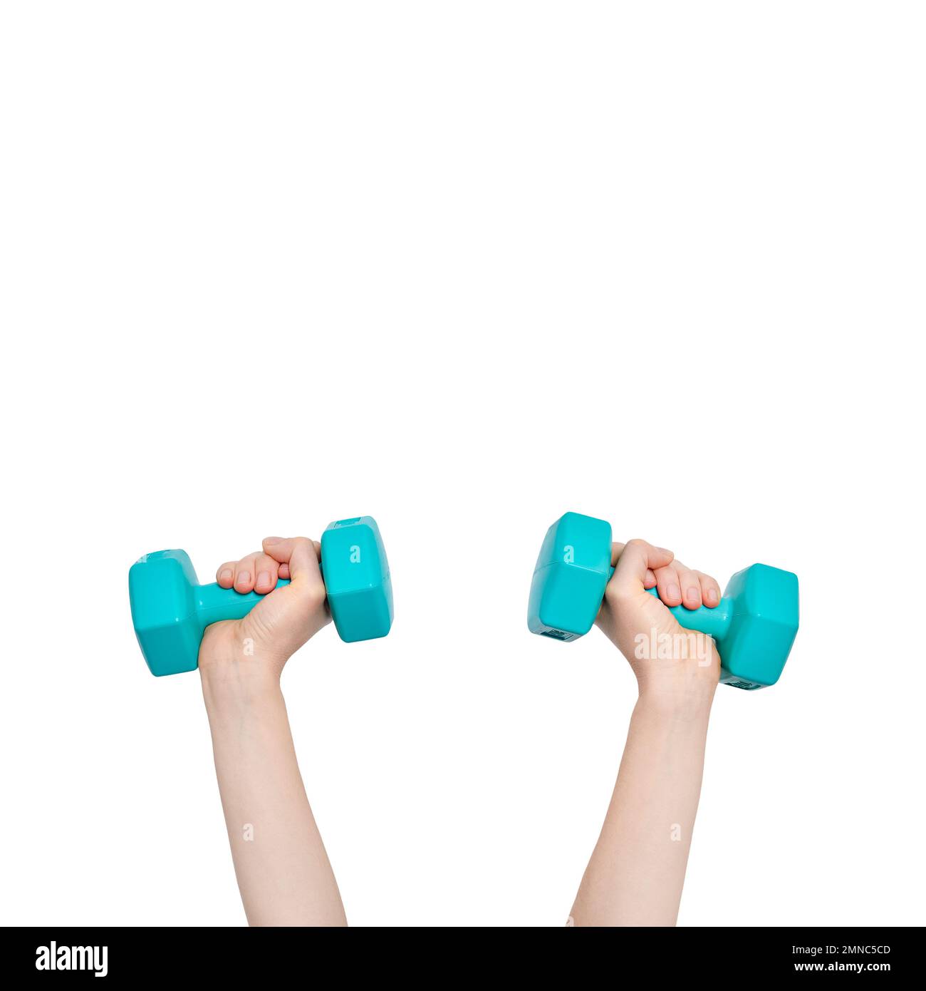 Two hands hold blue dumbbells weighing 1 kilogram each. Sport at home ...