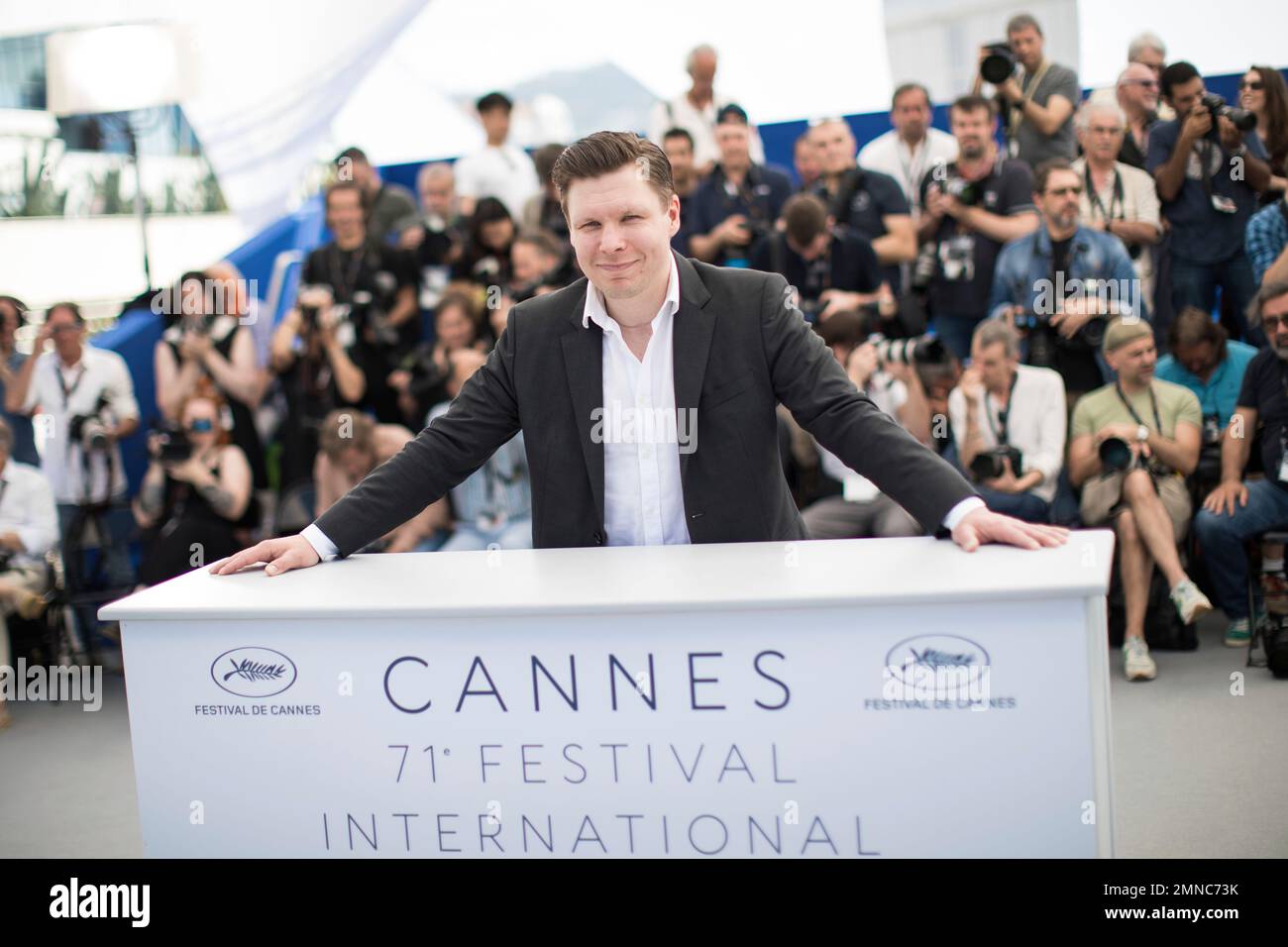 Actor Eero Milonoff poses for photographers during a photo call for the ...
