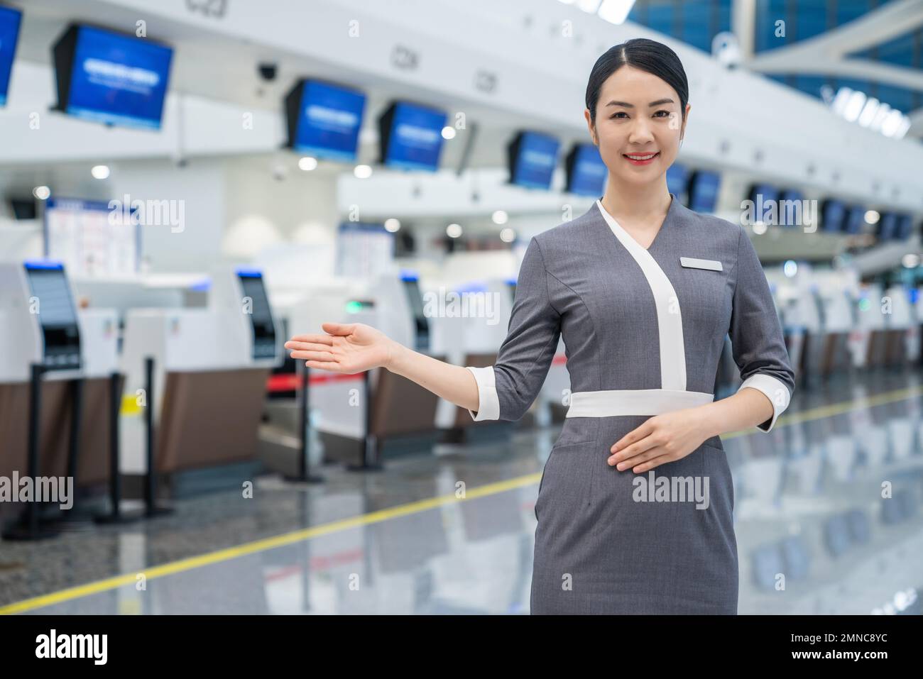 Smile of a flight attendant Stock Photo - Alamy