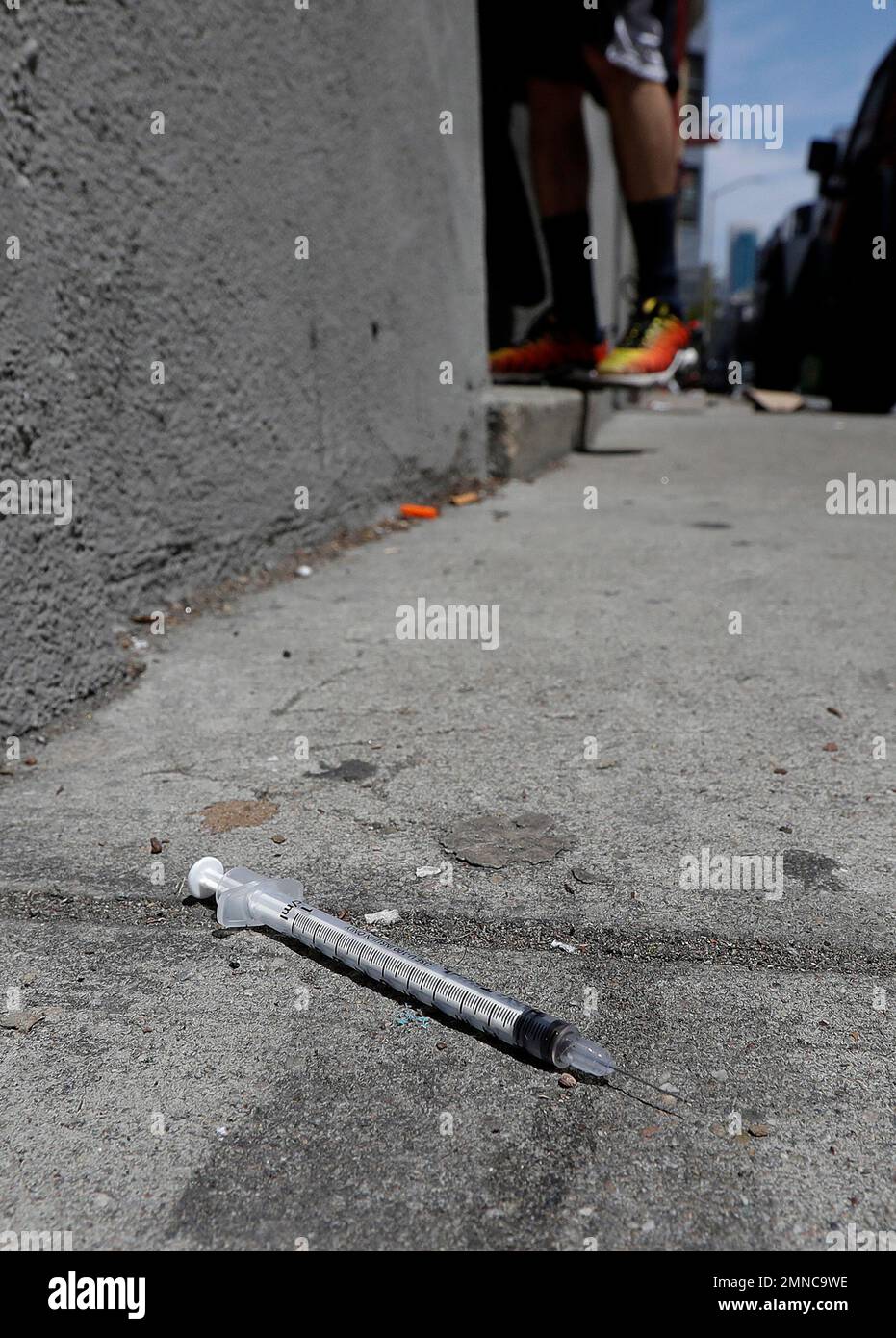 A used syringe is shown on a sidewalk in San Francisco, Thursday, May ...