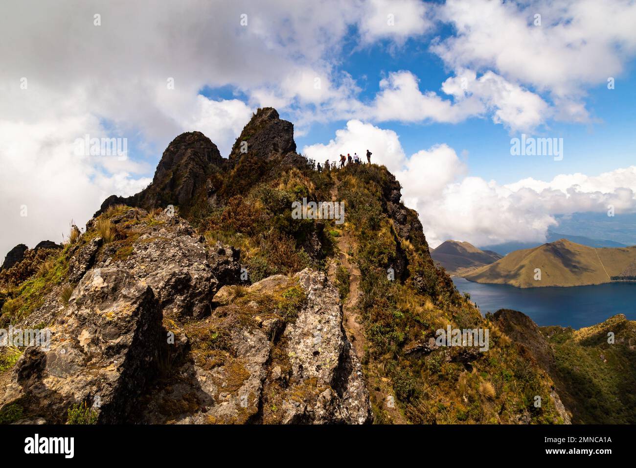 Peaks on the edge of a volcano covered with Andean vegetation on one ...