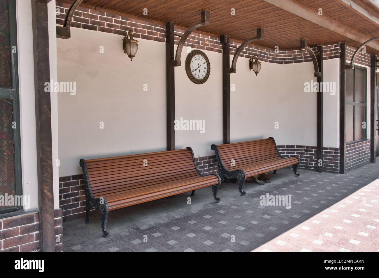 City public transport station in classic retro style with two benches ...