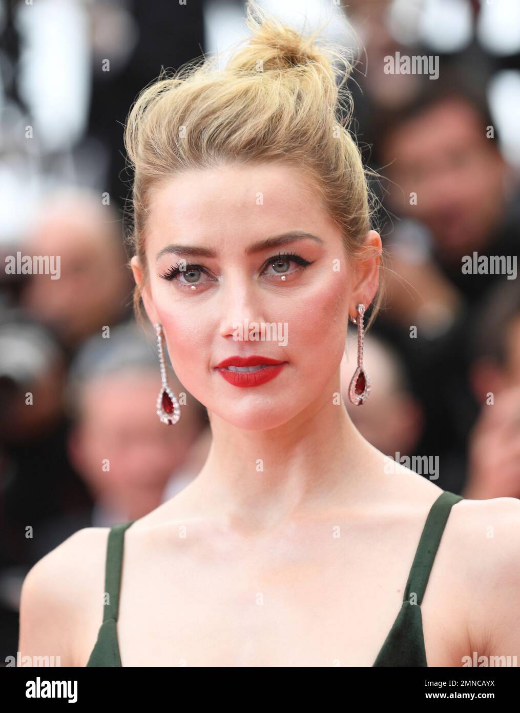 Actress Amber Heard poses for photographers upon arrival at the ...