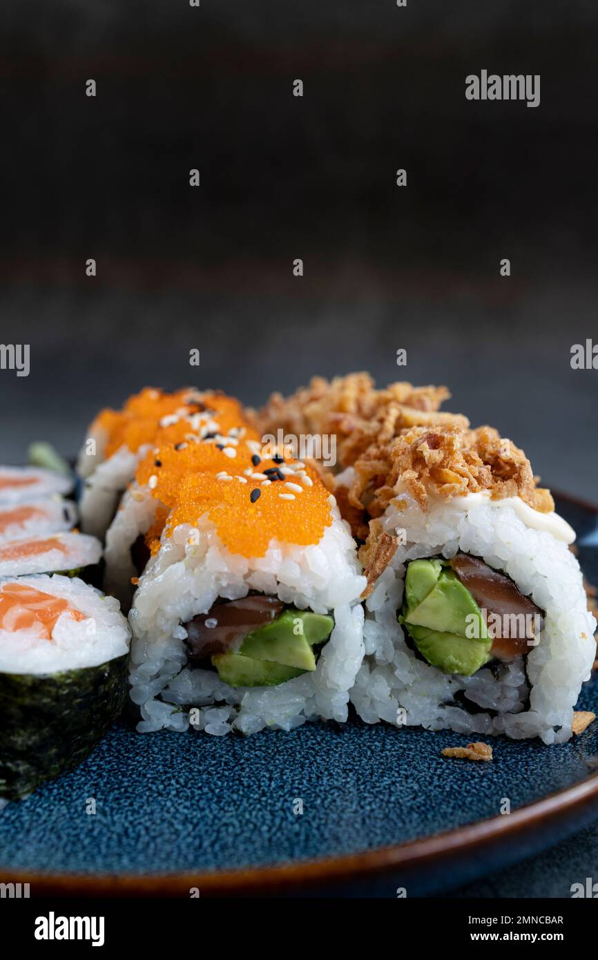 Sushi roll sushi with shrimp, avocado, red caviar , sesame. Sushi menu ...