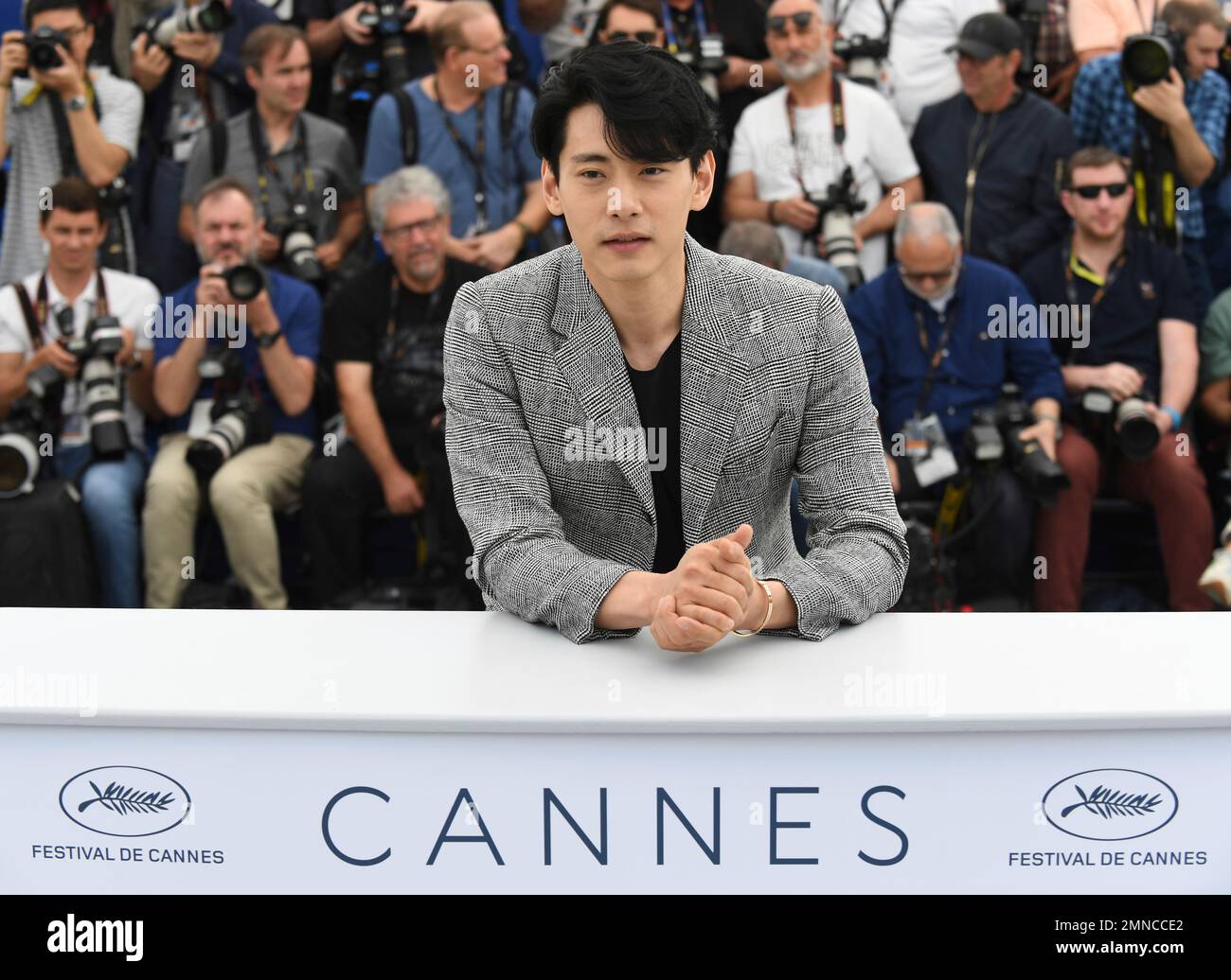 Actor Teo Yoo poses for photographers during a photo call for the film ...