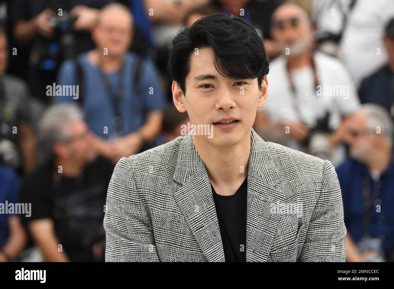 Actor Teo Yoo poses for photographers during a photo call for the film 'Leto' at the 71st ...