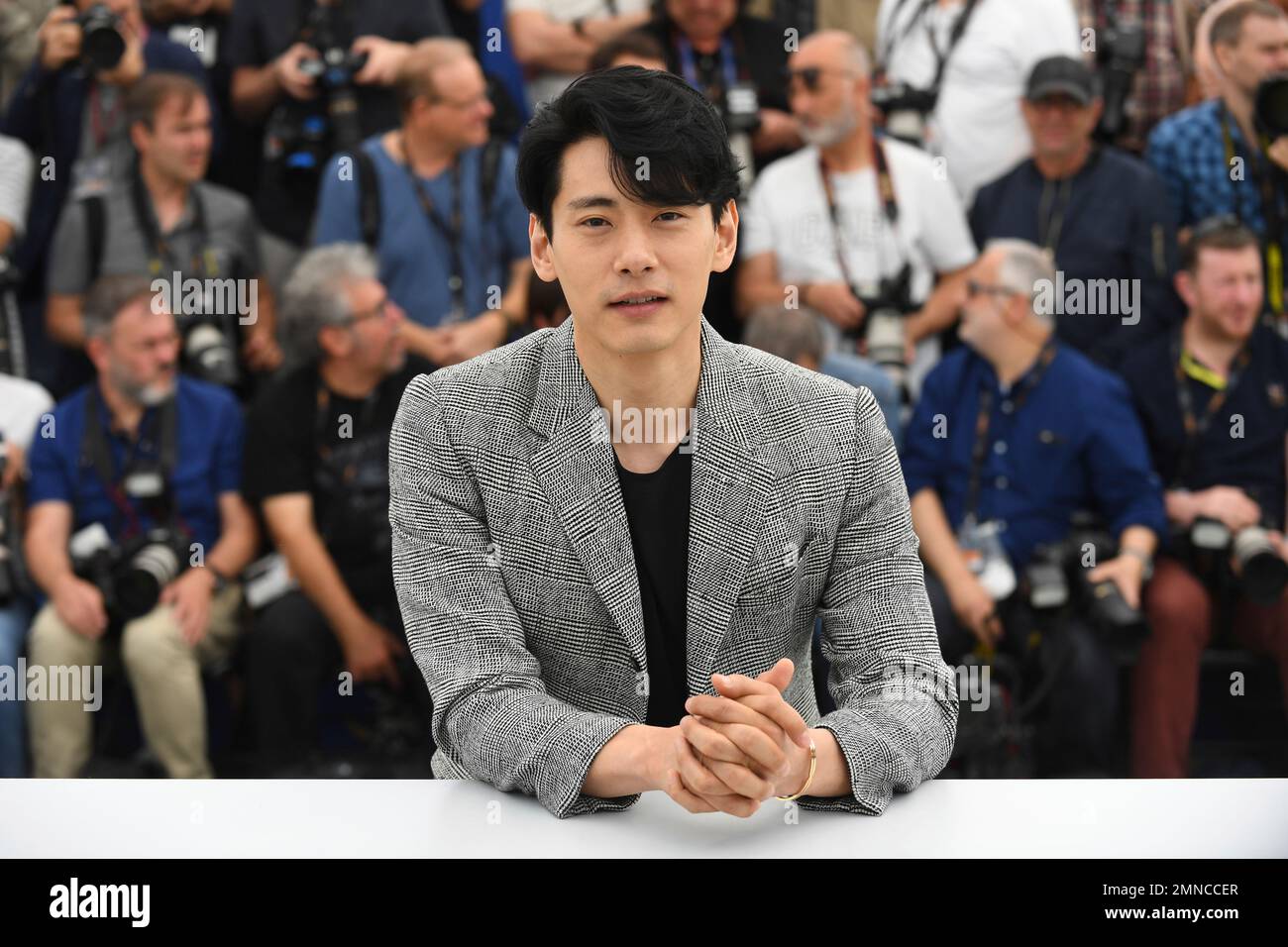 Actor Teo Yoo poses for photographers during a photo call for the film ...