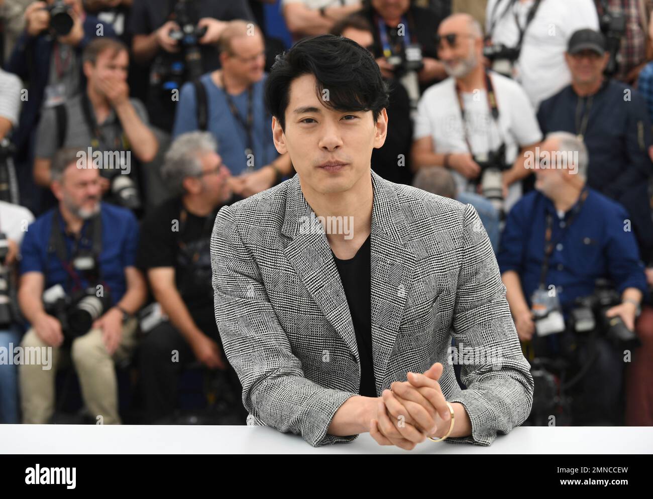 Actor Teo Yoo poses for photographers during a photo call for the film ...