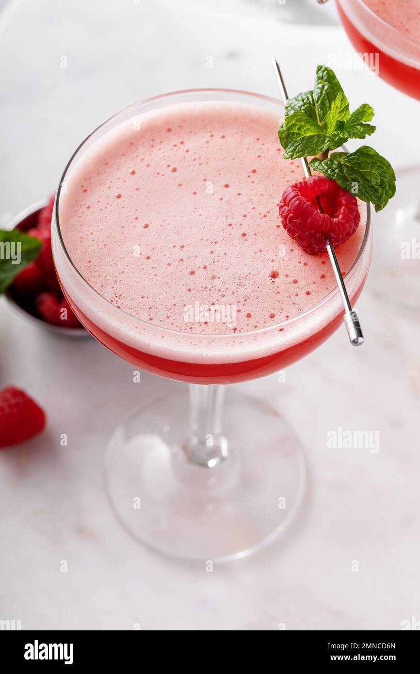 Raspberry martini cocktail with vodka, pineapple juice and raspberry ...