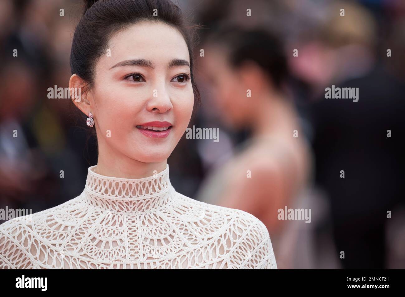 Model Wang Likun poses for photographers upon arrival at the premiere ...