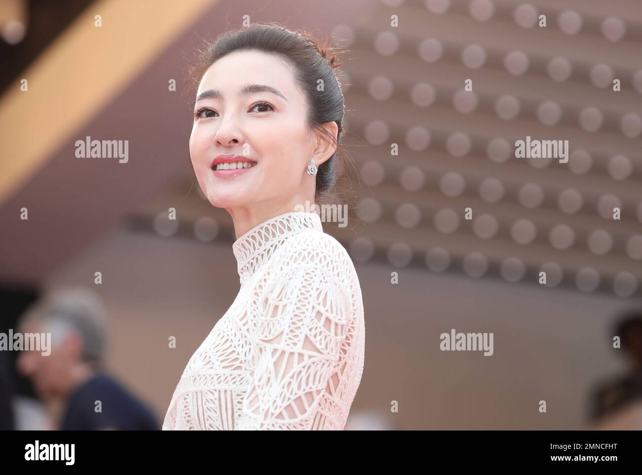 Actress Wang Likun poses for photographers upon arrival at the premiere ...
