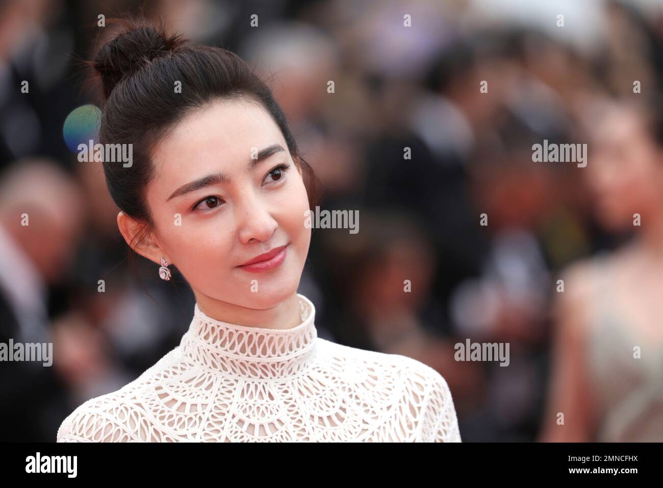 Actress Wang Likun poses for photographers upon arrival at the premiere ...