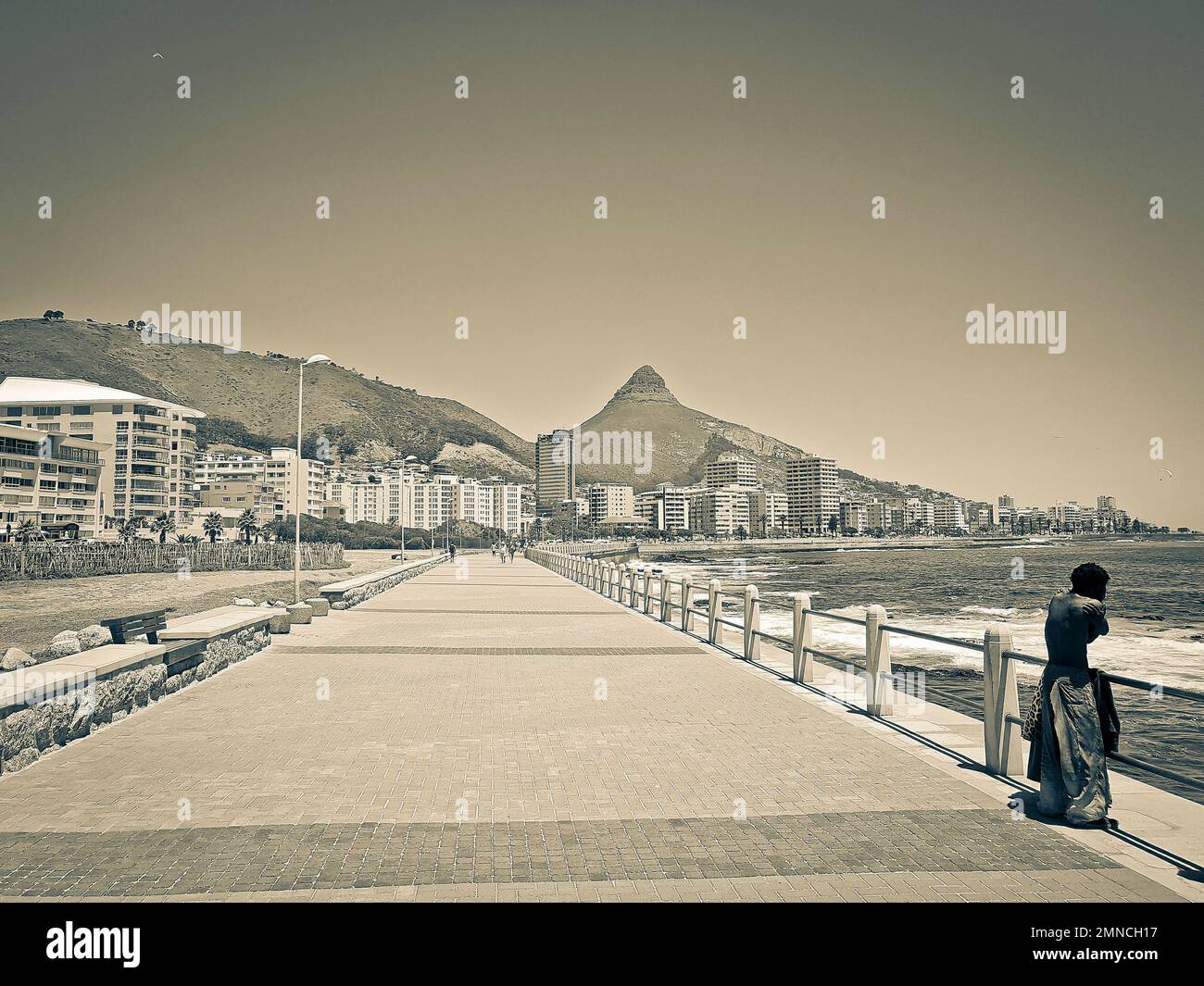 Poor and rich life at the Sea Point, beach promenade in Cape Town South ...