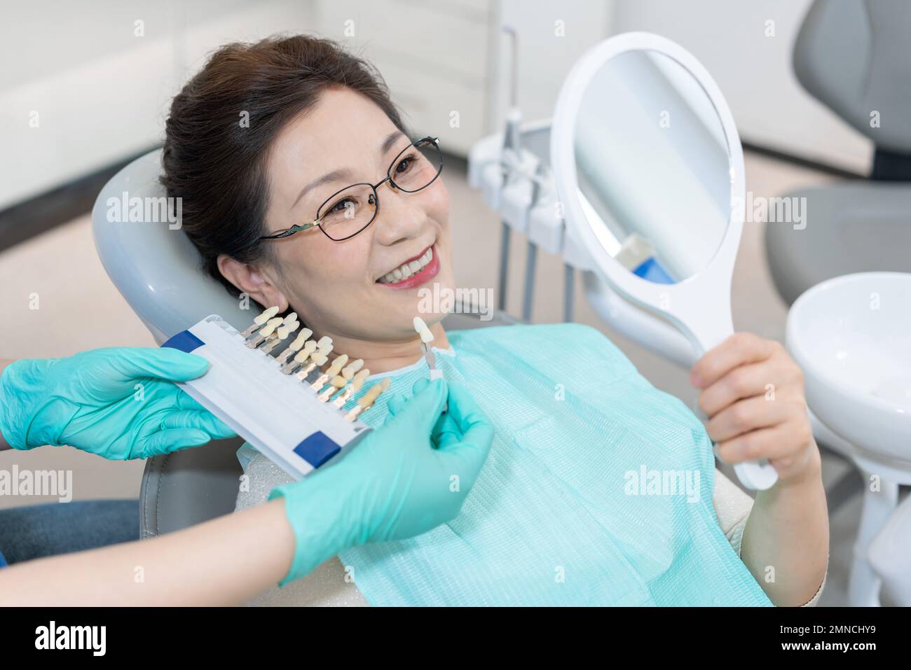 Patients in the dental clinic matching teeth Stock Photo - Alamy
