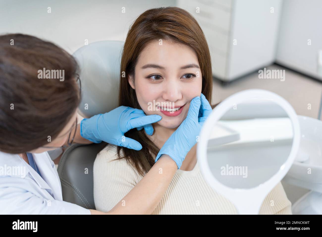 Doctors and patients in dental clinic Stock Photo - Alamy